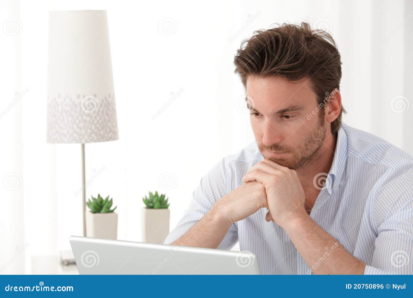 Thinking man with laptop stock photo. Image of concentration - 20750896