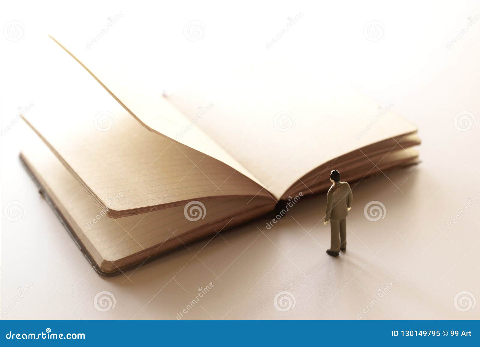 Thinking Man, Miniature Man Sitting Alone On Notebook. Royalty-Free ...