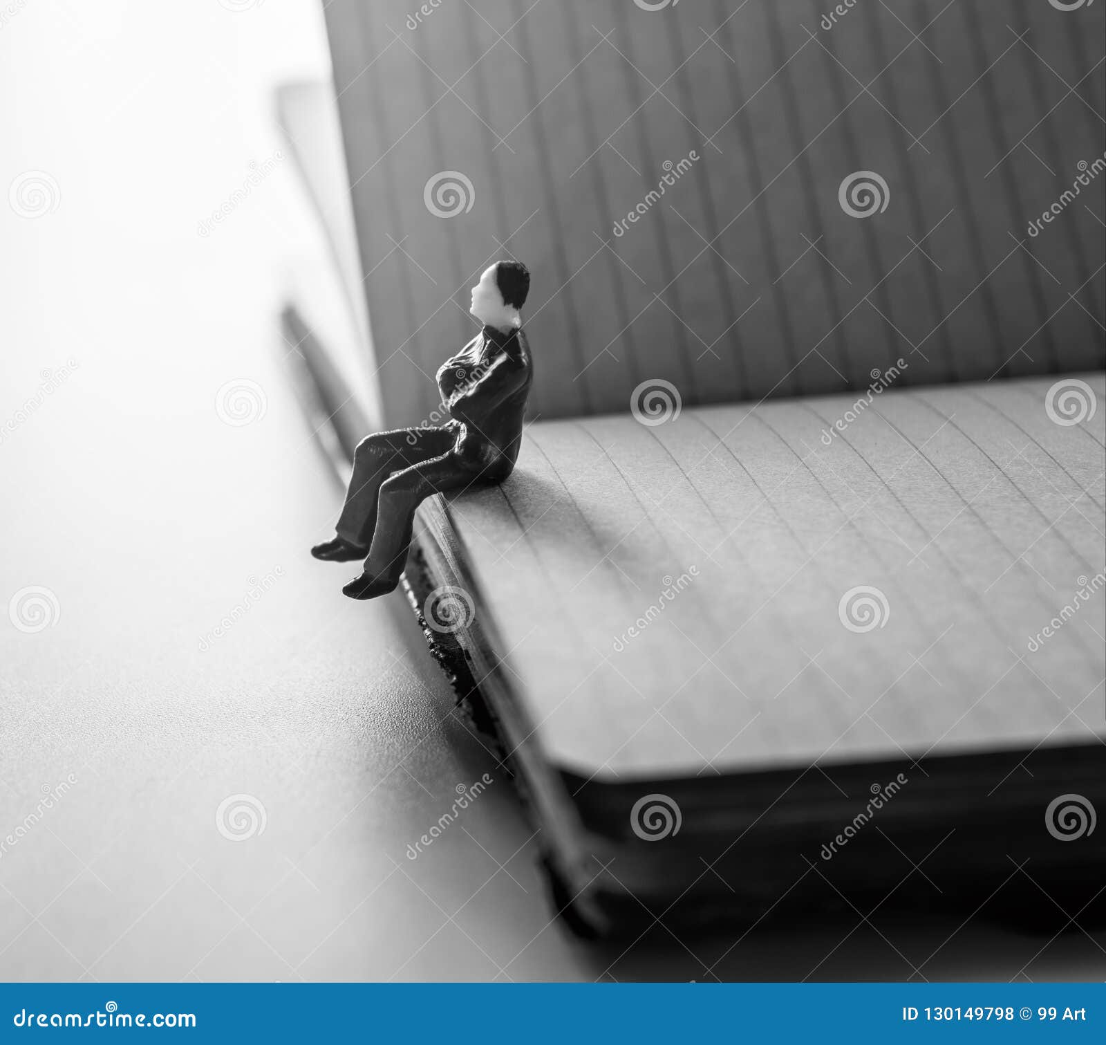 Thinking Man, Miniature Man Sitting Alone on Notebook. Stock Photo ...