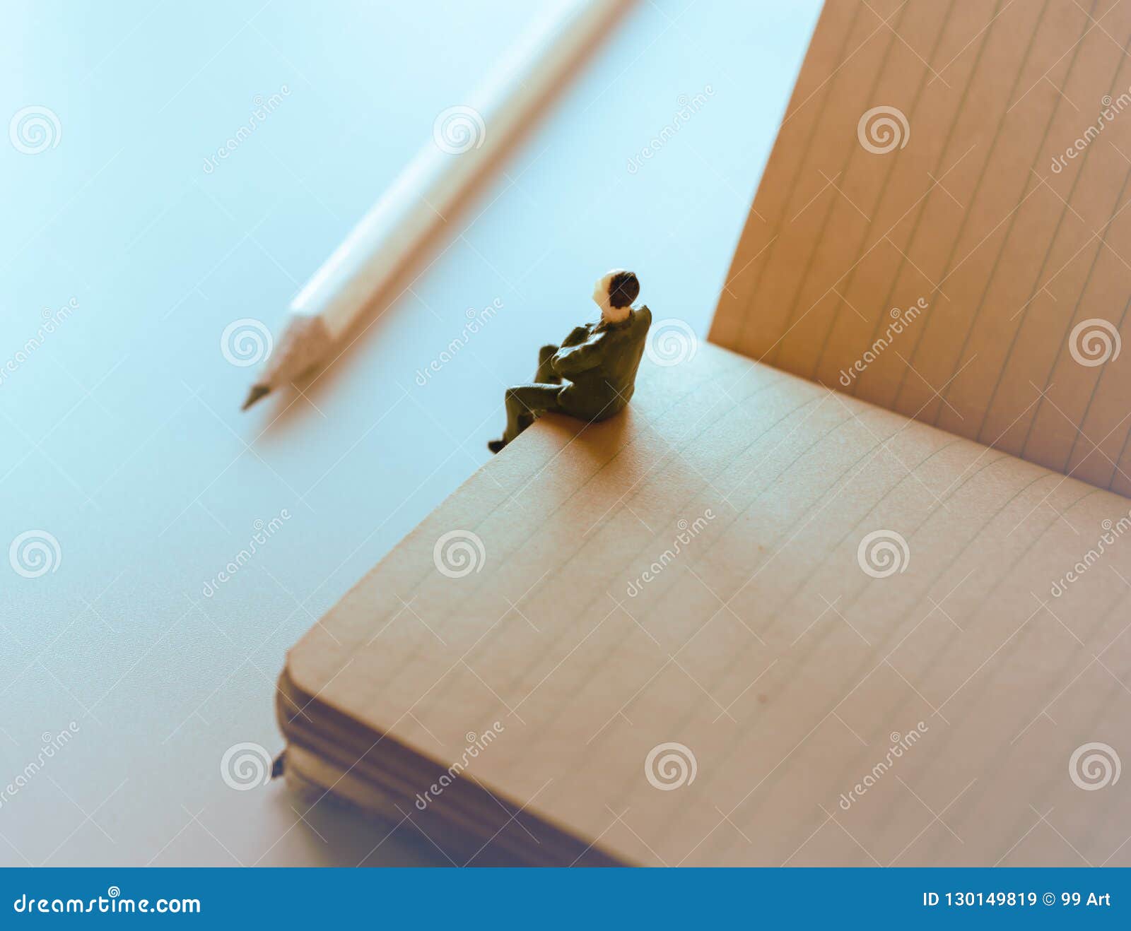 Thinking Man, Miniature Man Sitting Alone on Notebook. Stock Image ...