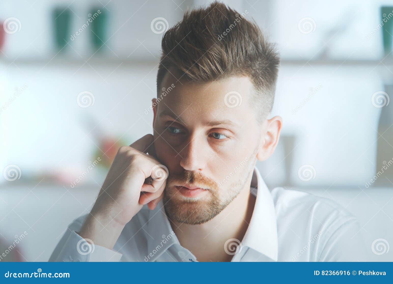 Thinking European Businessman Standing In Concete Interior With ...