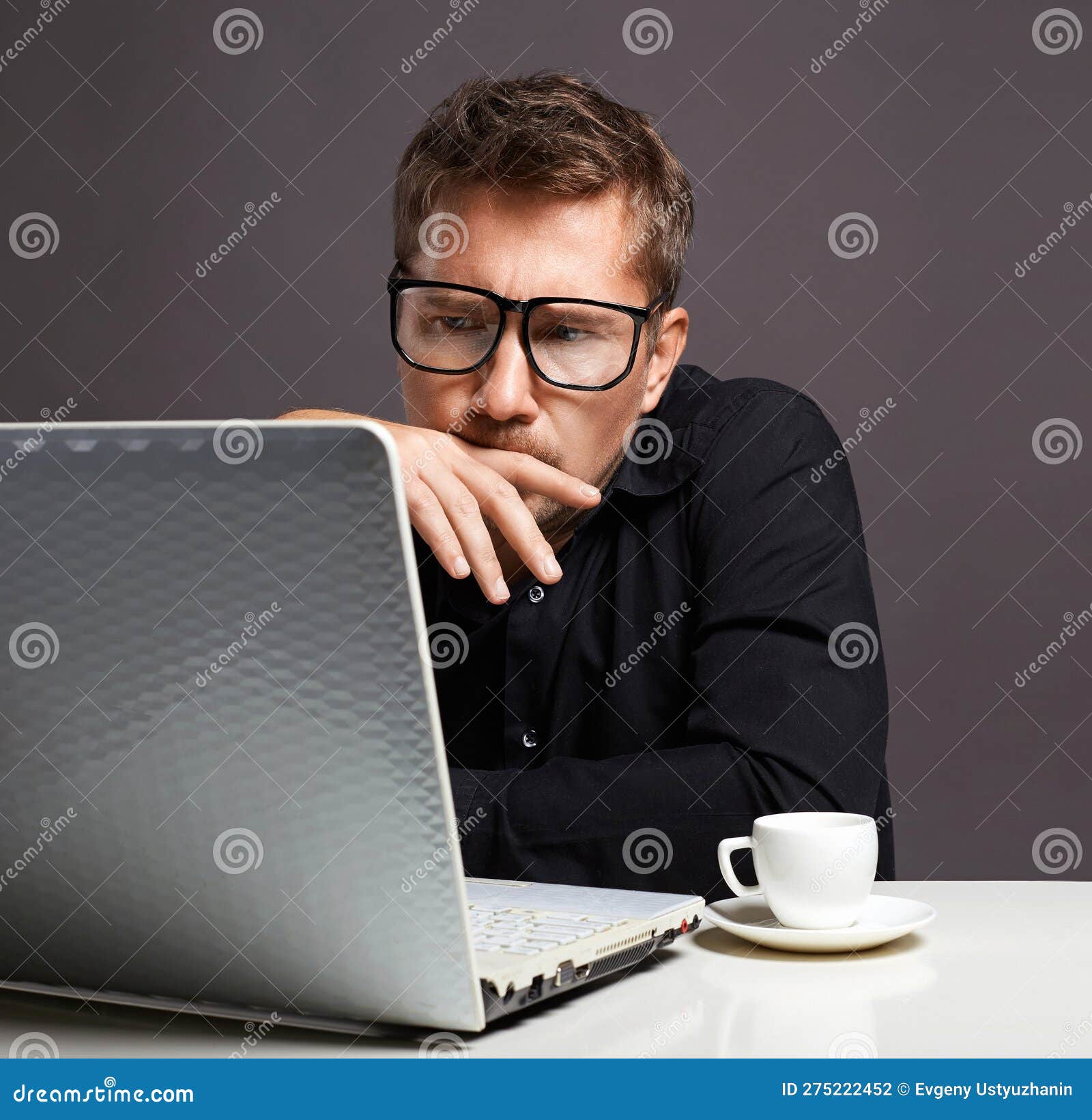 Thinking Man Sitting at a Computer. Funny Boy in Glasses Stock Photo ...