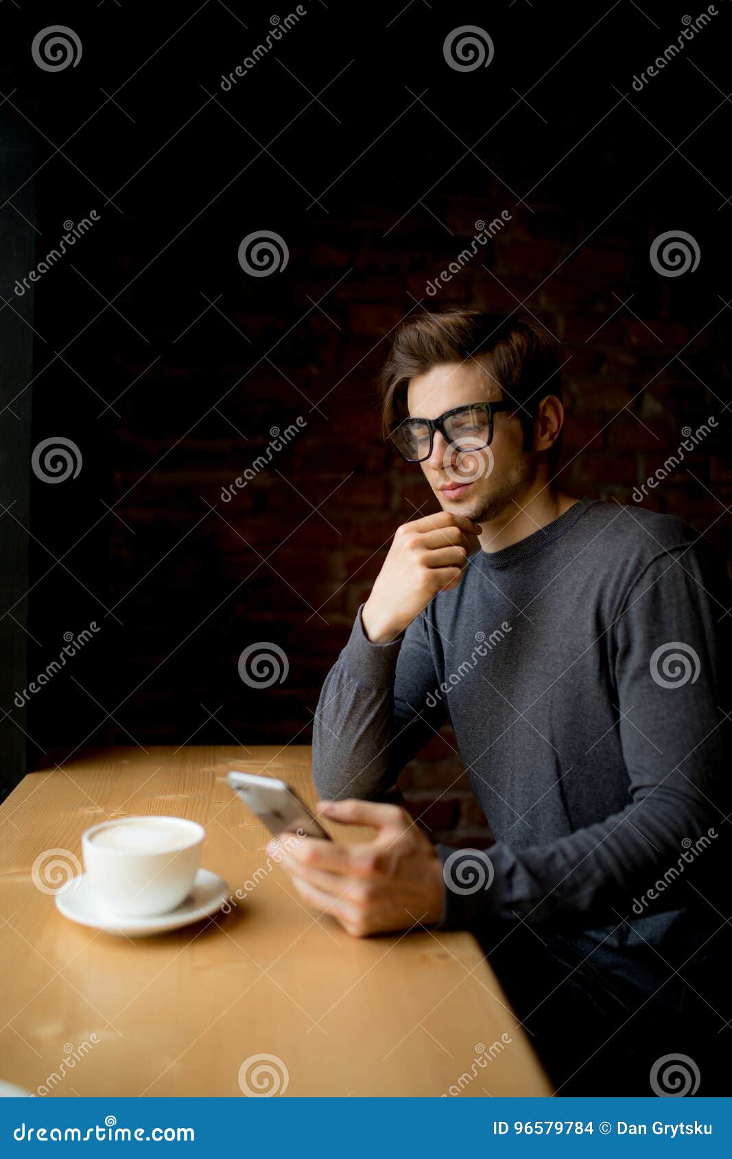 Thinking Man Using His Phone while Drink Coffee Stock Photo - Image of ...