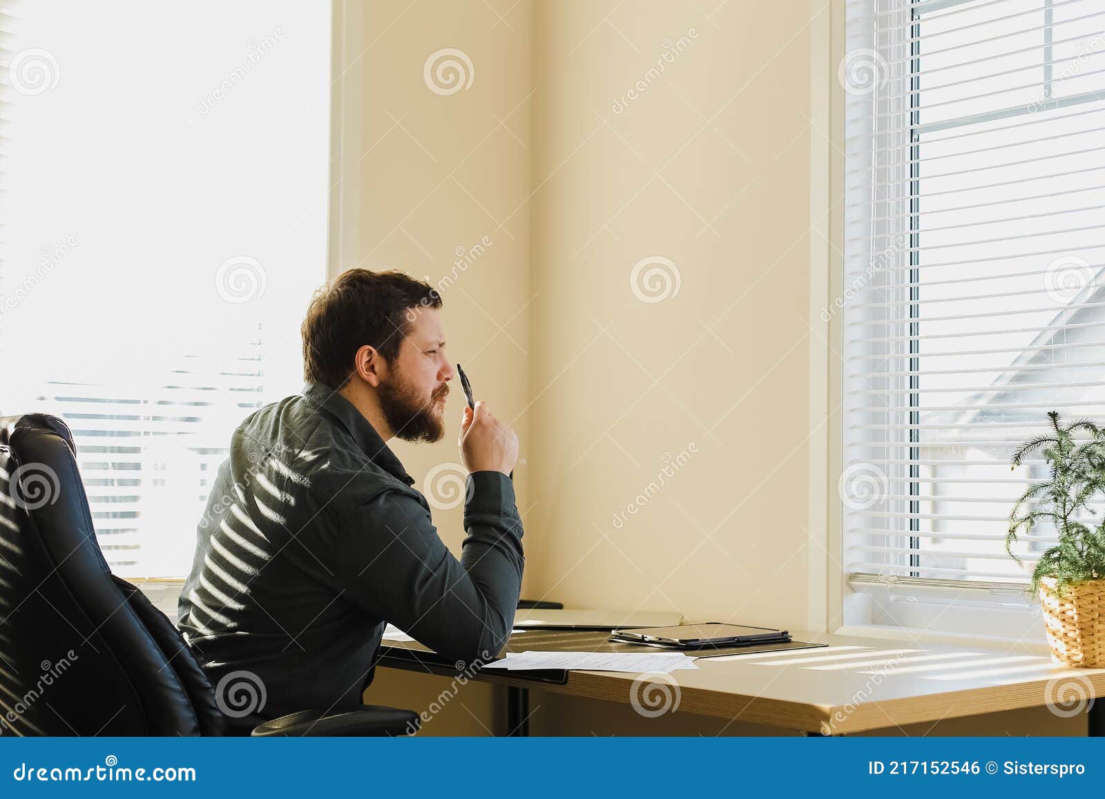 Thinking Manager Sitting at Office with Documents, Tablet on Table ...