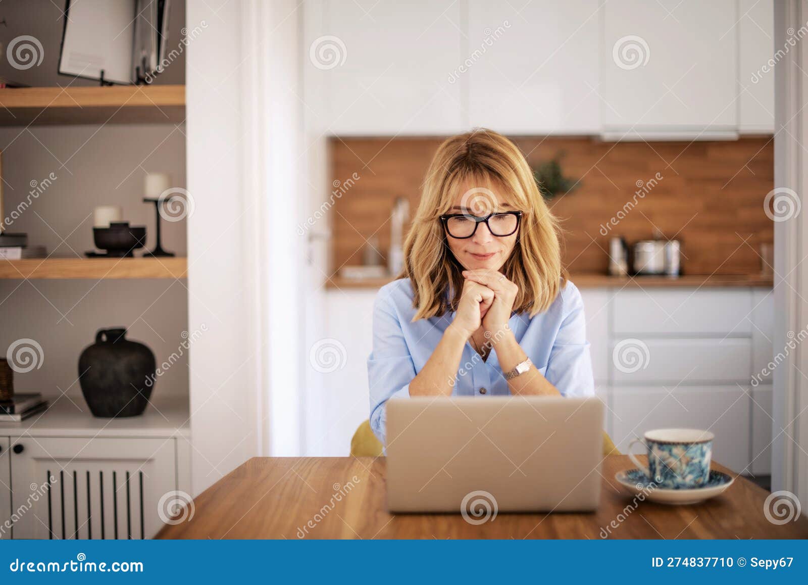 Attractive Woman with Laptop Sitting at Home and Working Stock Photo ...