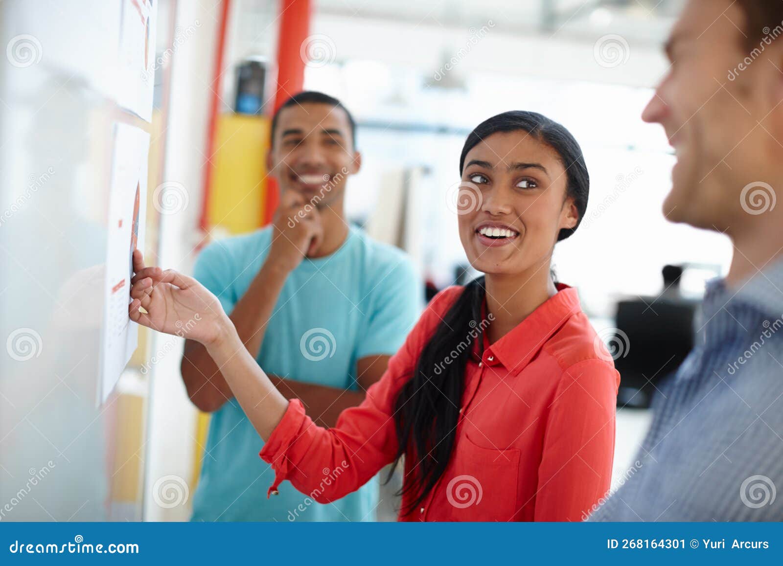 Thinking Outside the Box. a Group of Young Designers Brainstorming at a ...