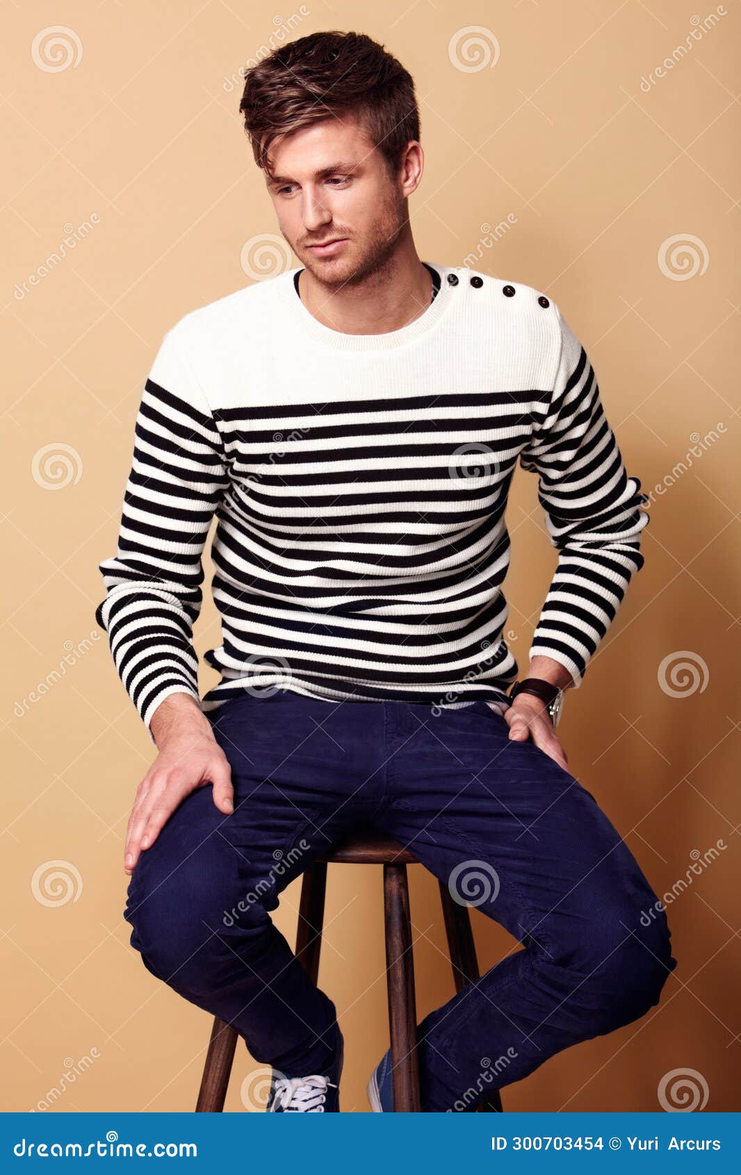 Thinking, Sad or Regret with a Man on a Stool in Studio on Tan ...