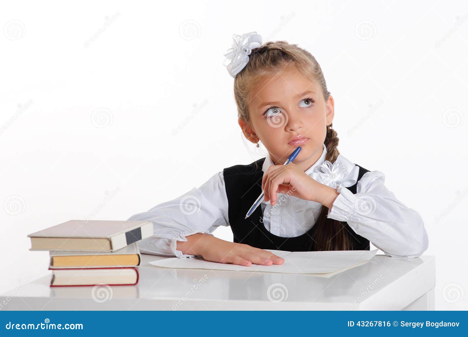 Thinking schoolgirl stock photo. Image of schoolchild - 43267816