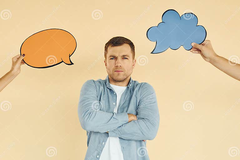 Thinking about Two Ideas. Man Standing in the Studio with Empty Signs ...