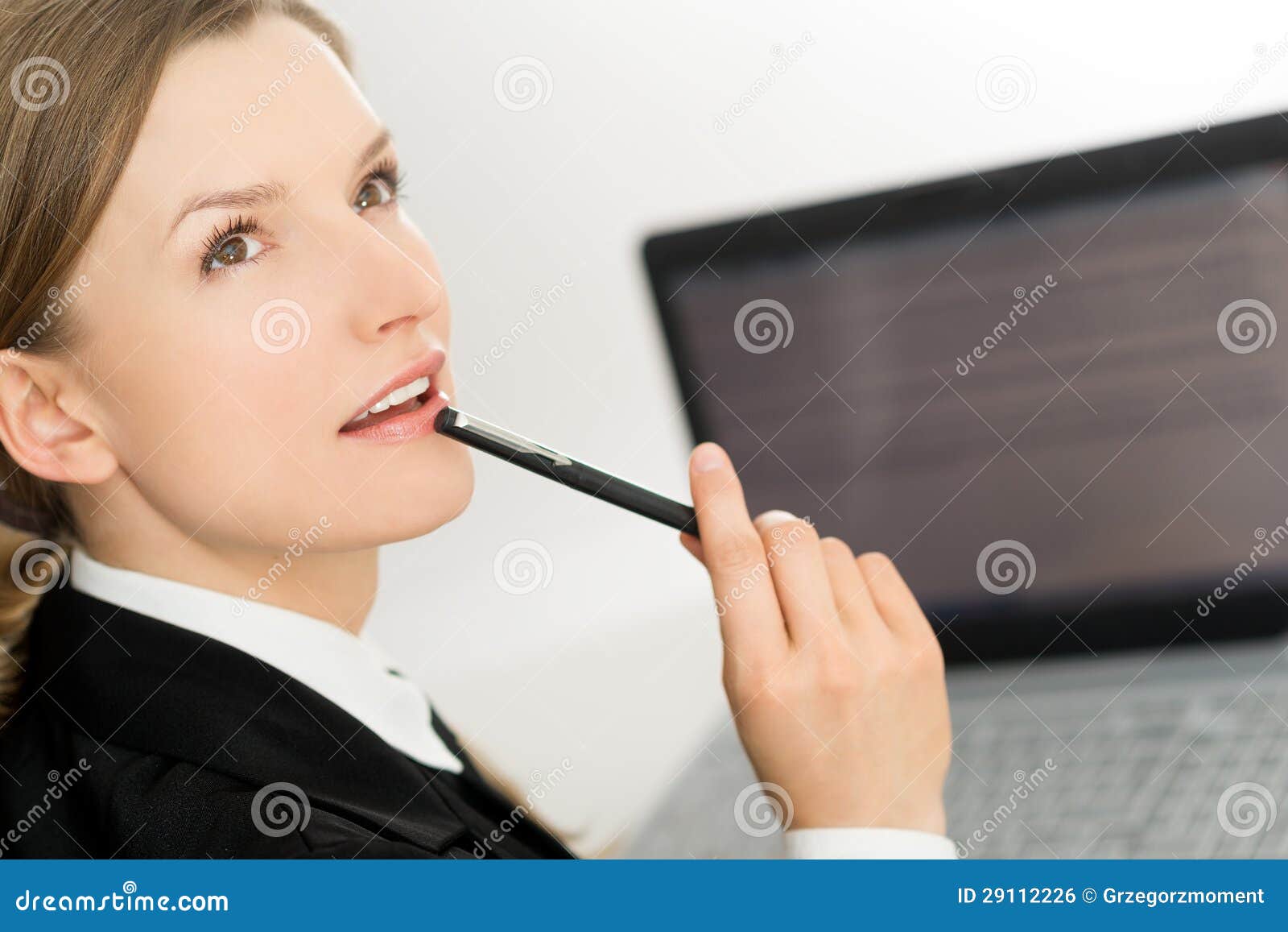 Thinking Woman Presenting Laptop Screen and Pen Stock Photo - Image of ...