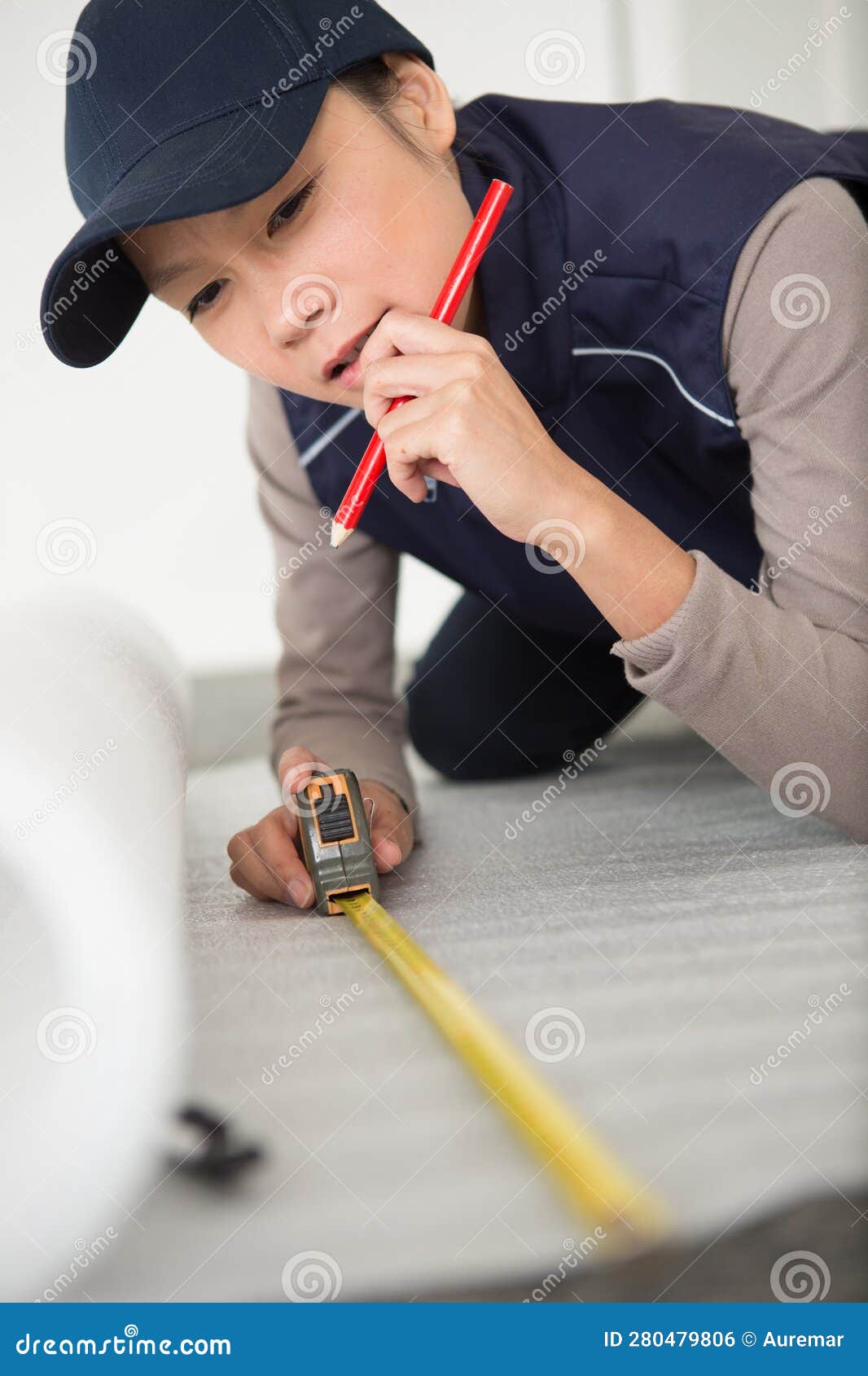 Thinking Woman with Ruler Measuring Wallpaper at Home Stock Photo ...