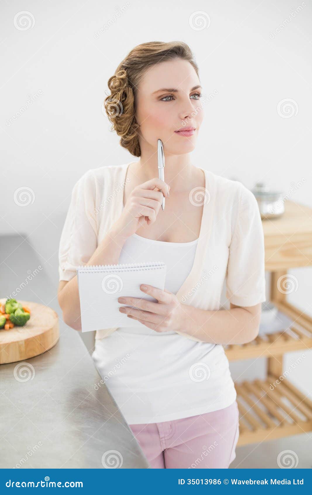Thinking Woman Standing in Kitchen Writing a Shopping List Stock Photo ...