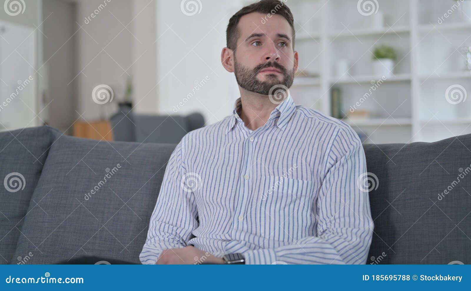 Thinking Young Man Sitting at Home Stock Photo - Image of busy ...