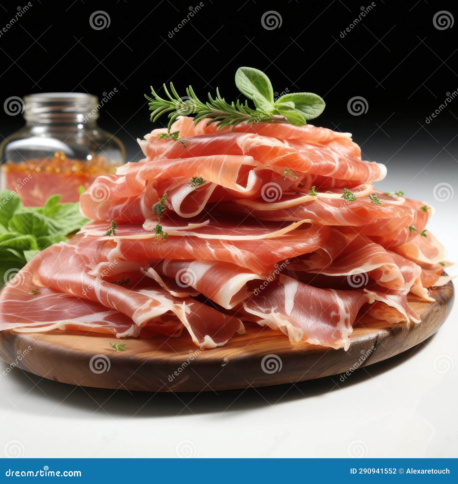 Thinly Sliced Jamon with Green Leaves on a Plate on the Table Stock ...