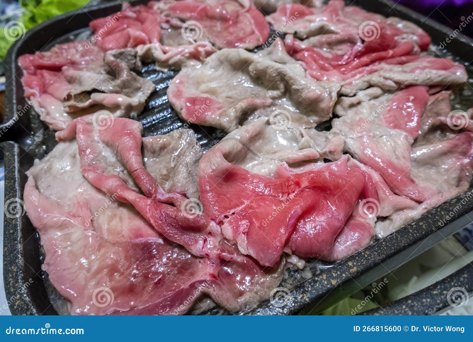 Thinly Sliced Pieces of Beef in the Process of Being Fried on a Hot ...