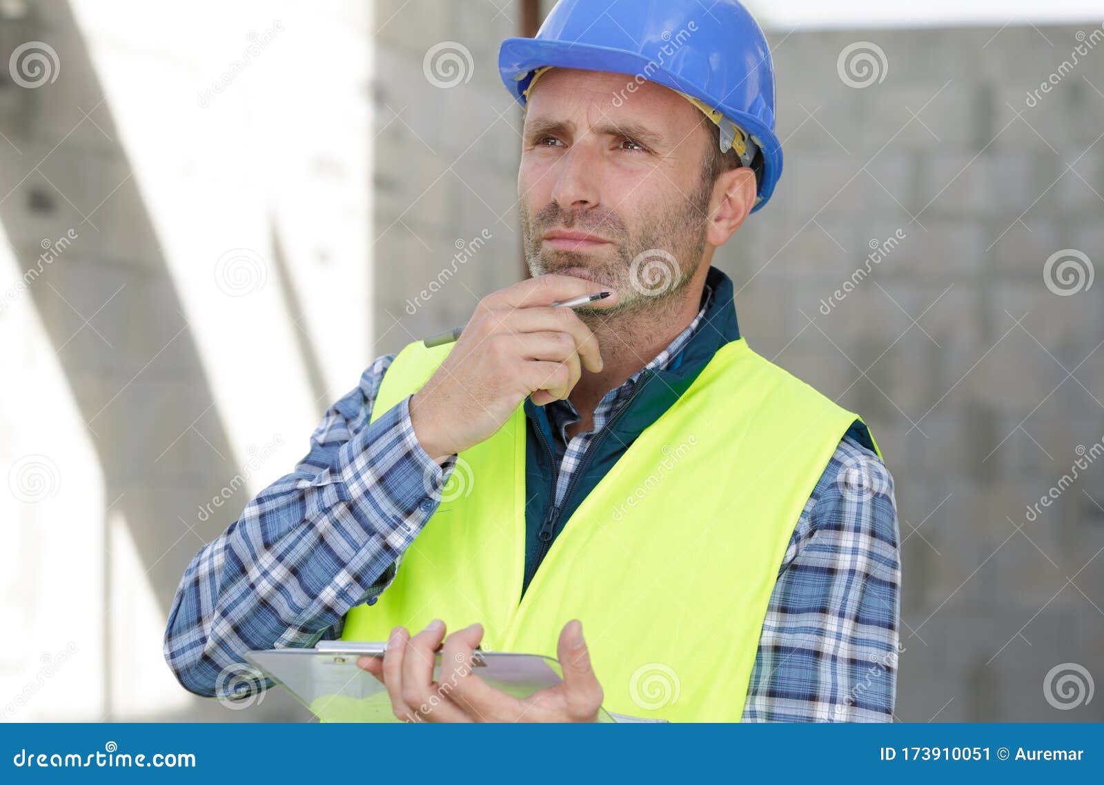 Thoughful Engineer Writing on Writing Pad Outdoors Stock Image - Image ...