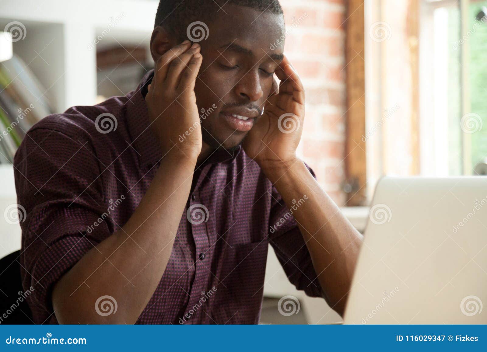 Thoughtful African American Solving Problem Working at Laptop Stock ...
