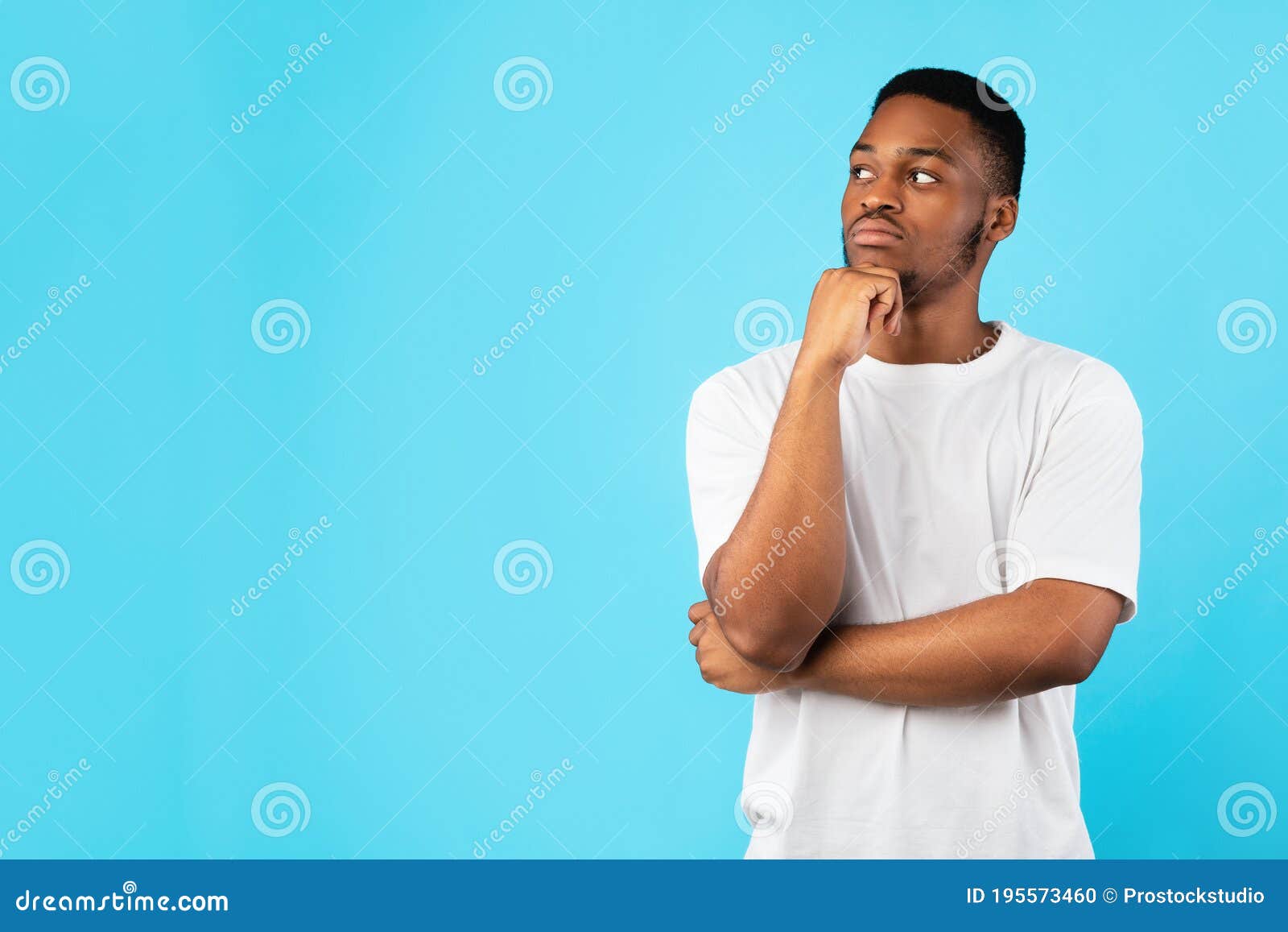 Thoughtful African Man Thinking Looking Aside Posing Over Blue ...