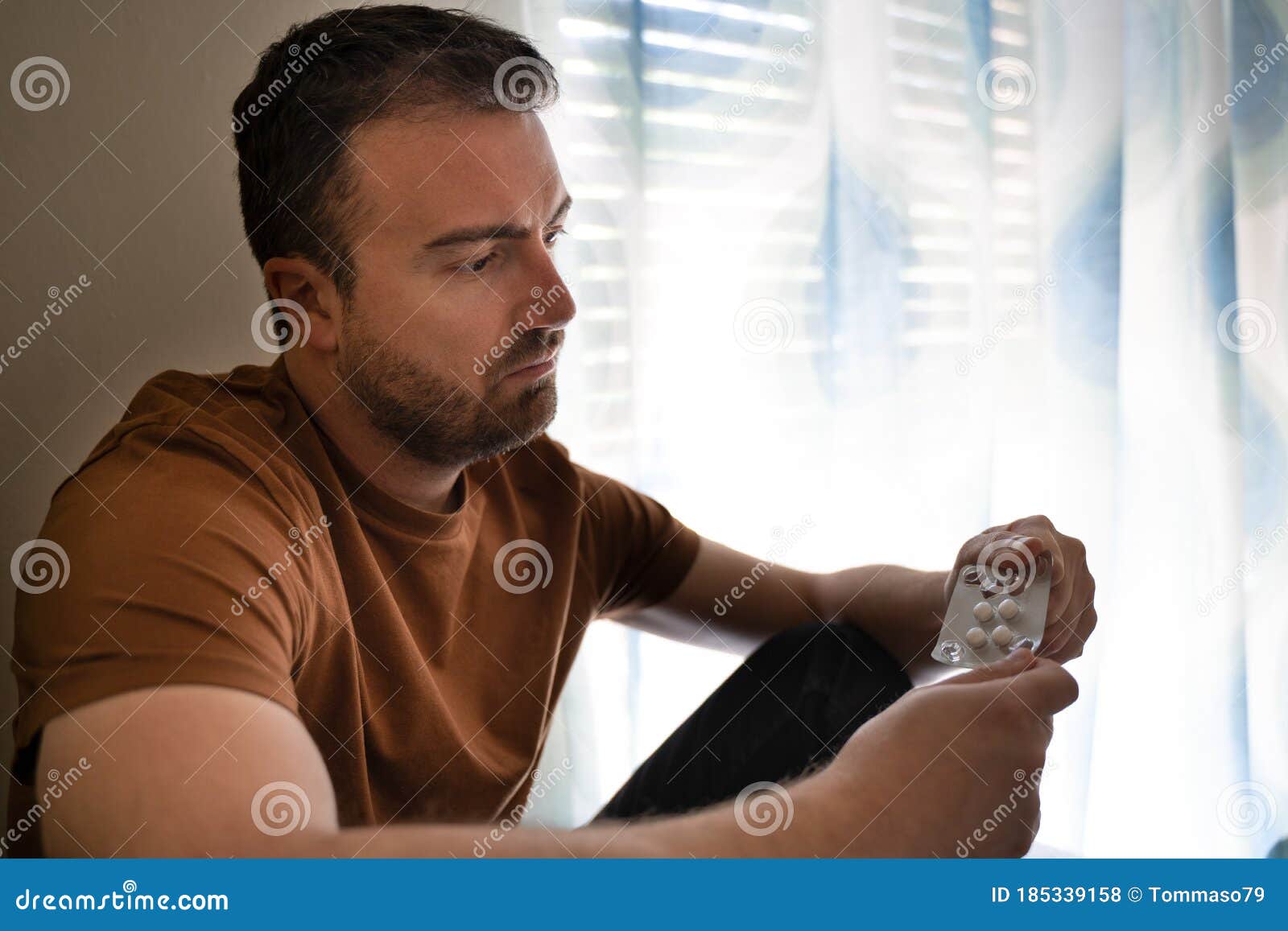 Portrait of One Guy Longing and Looking through Window Stock Photo ...