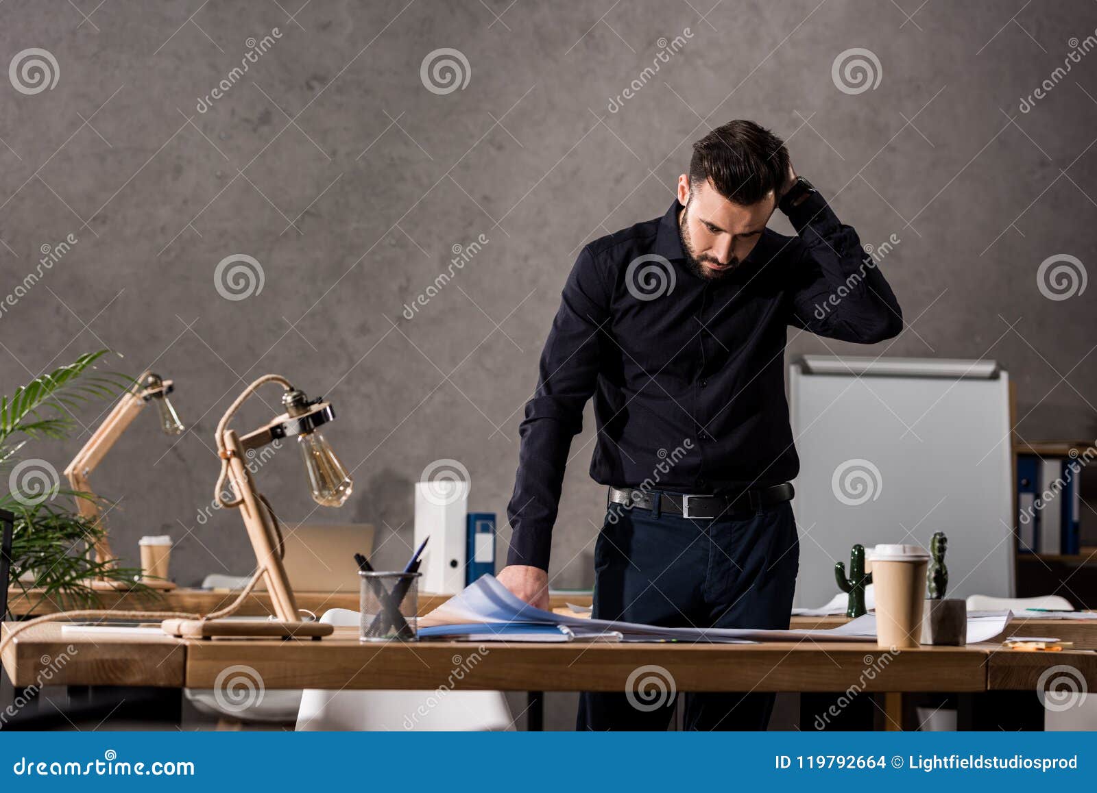 Thoughtful Architect Standing Near Working Table and Looking Stock ...