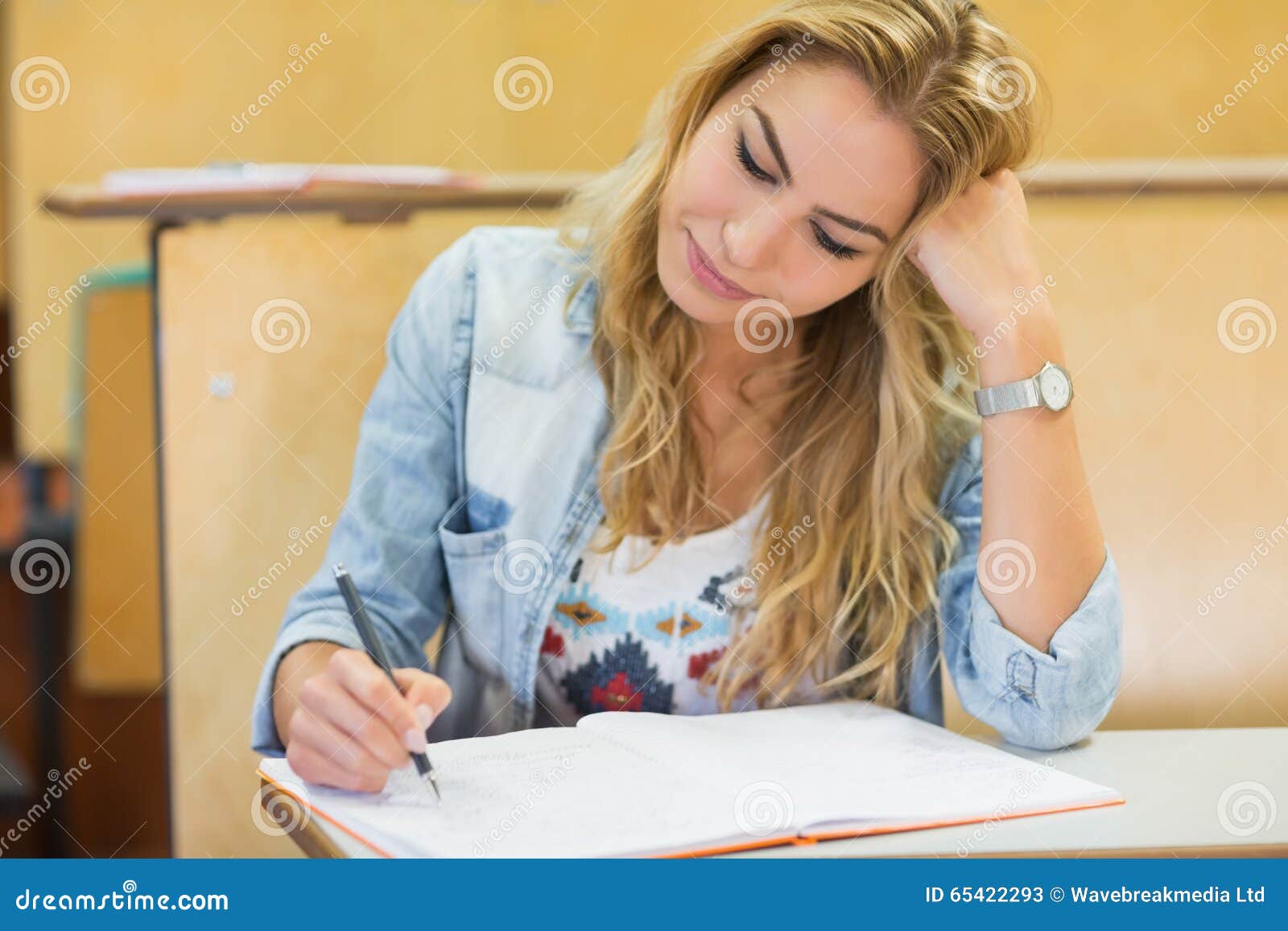 Thoughtful Attractive Student Writing during Class Stock Image - Image ...
