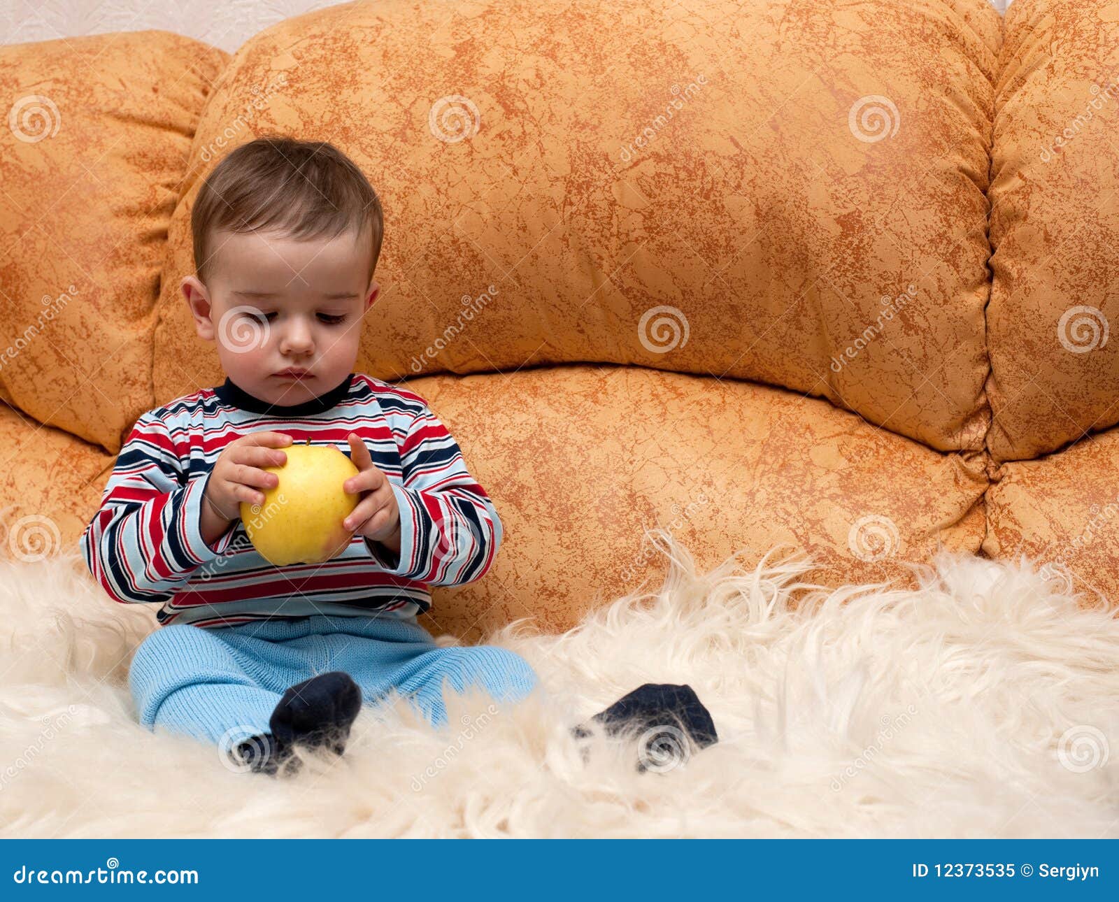 Thoughtful Baby Boy Holding an Apple Stock Image - Image of hand, face ...