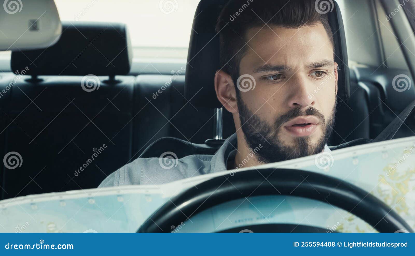 Thoughtful Bearded Man Looking at Map Stock Photo - Image of young ... Thoughtful Bearded Man Looking at Map Stock Photo - Image of young ...