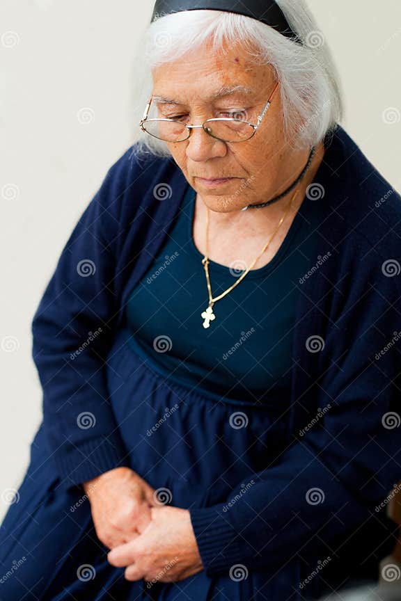 Thoughtful believer woman stock image. Image of elderly - 23080603