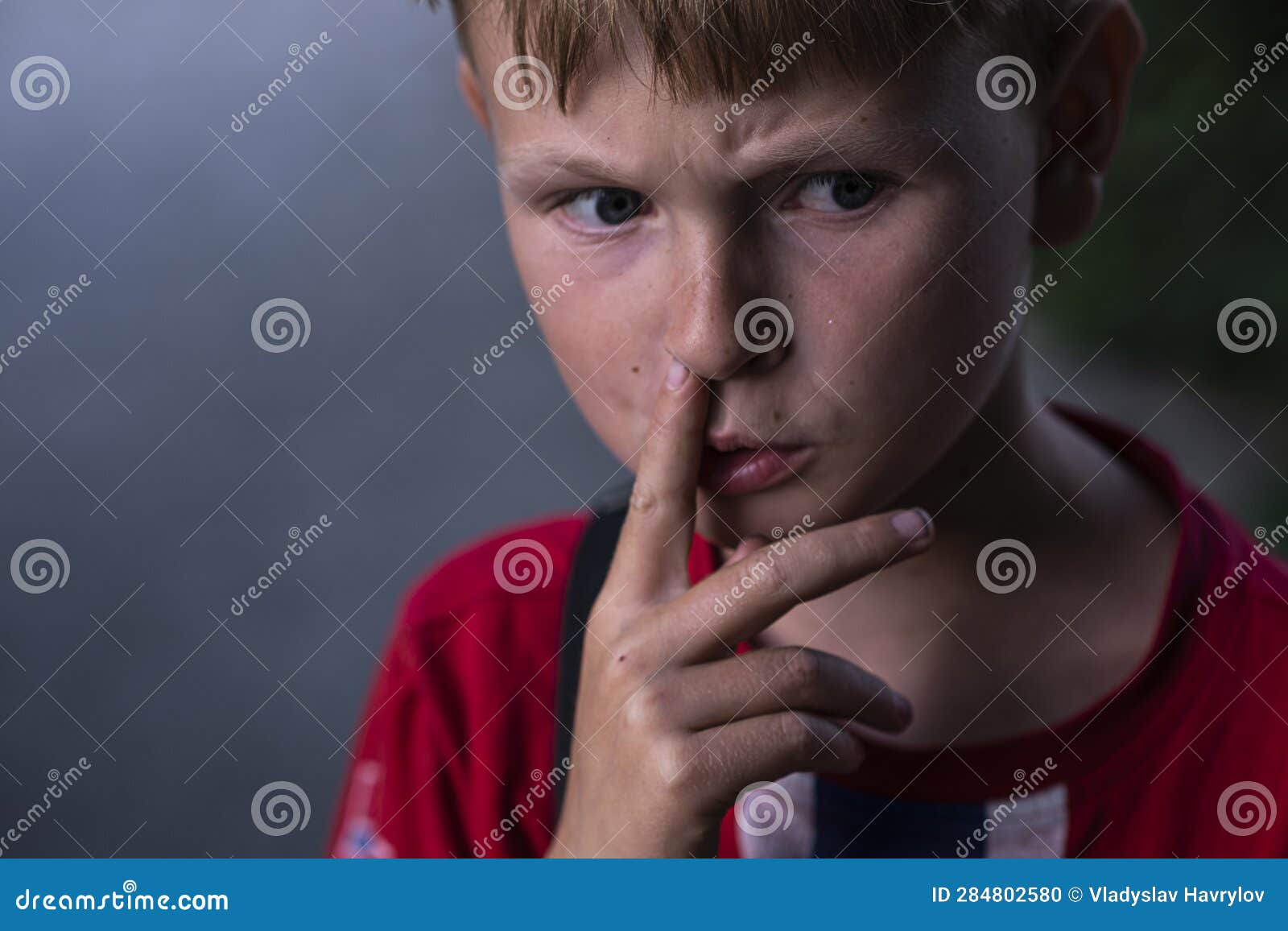 Thoughtful Boy Furrows His Brows. Boy Picking His Nose Stock Photo ...