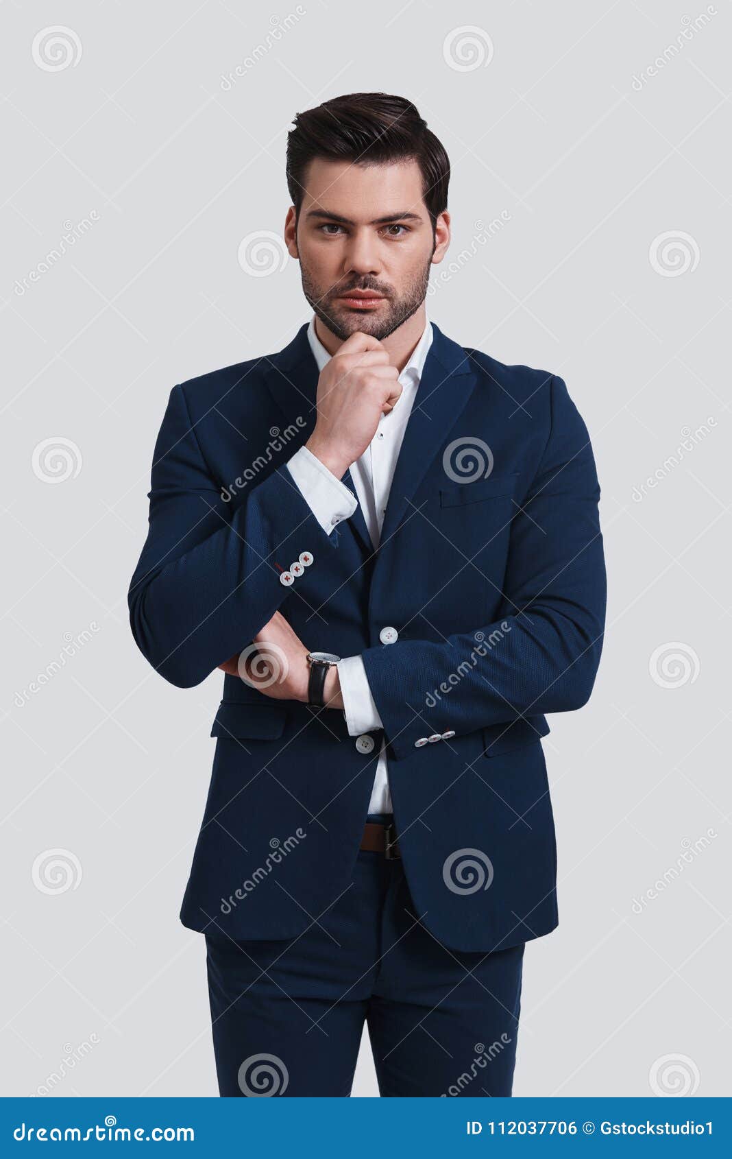 Thoughtful Businessman. Handsome Young Man in Full Suit Keeping Stock ... Thoughtful Businessman. Handsome Young Man in Full Suit Keeping Stock ...