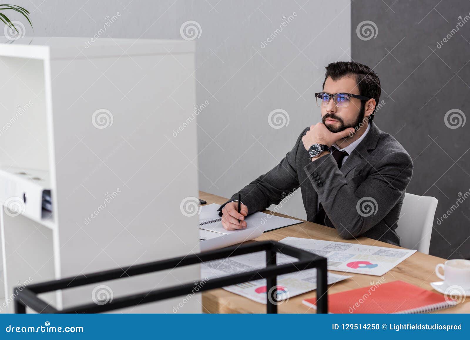 Thoughtful Businessman Sitting at Table Stock Photo - Image of ...