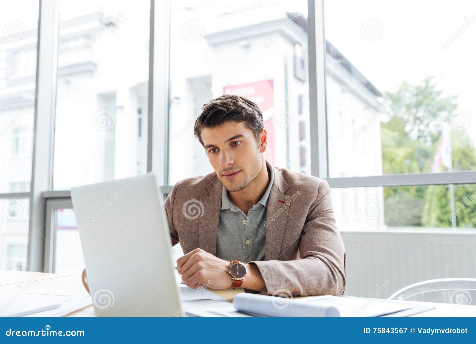 Thoughtful Businessman Working with Laptop and Thinking in Office Stock ... Thoughtful Businessman Working with Laptop and Thinking in Office Stock ...