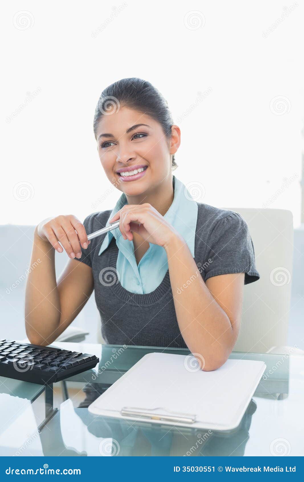 Thoughtful Businesswoman Looking Away At Office Desk Stock Image
