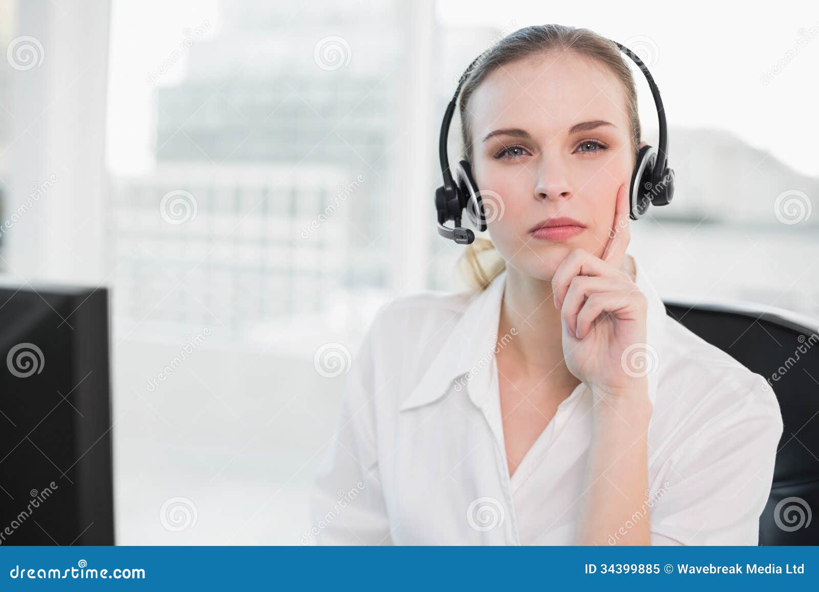 Thoughtful Call Centre Agent Looking at Camera Stock Image - Image of ...