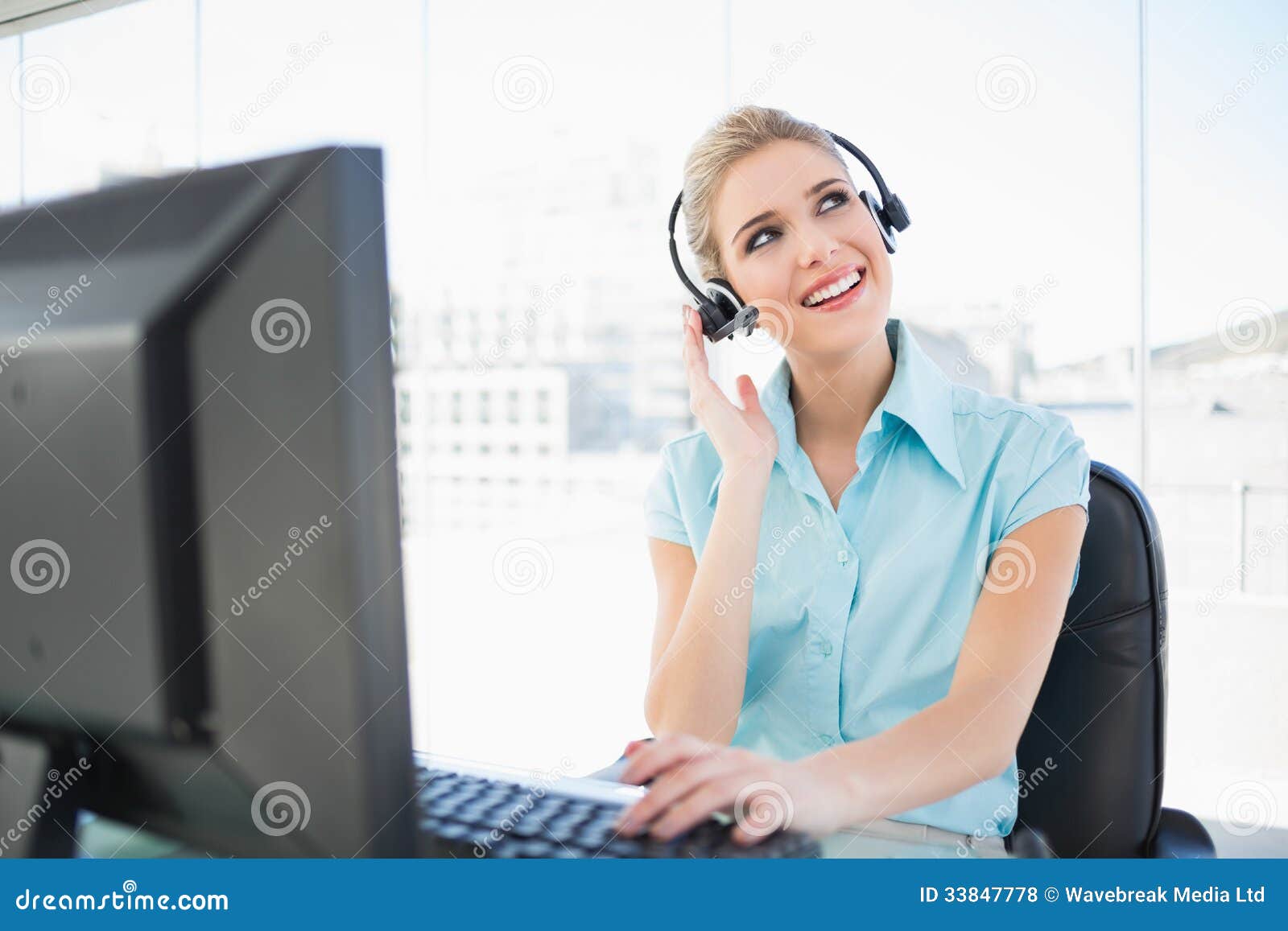 Thoughtful Call Centre Agent Working on Computer Stock Photo - Image of ...