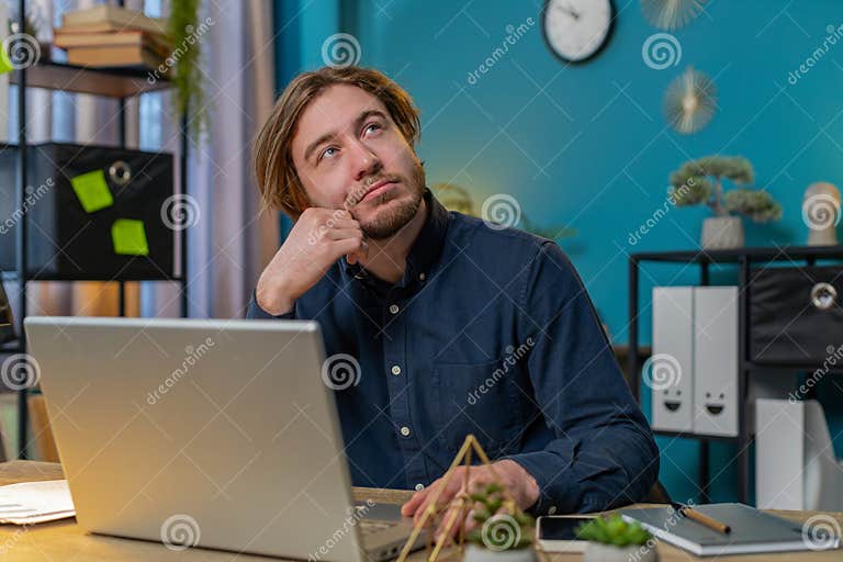 Thoughtful Concerned Businessman Working on Laptop Computer Looking ...