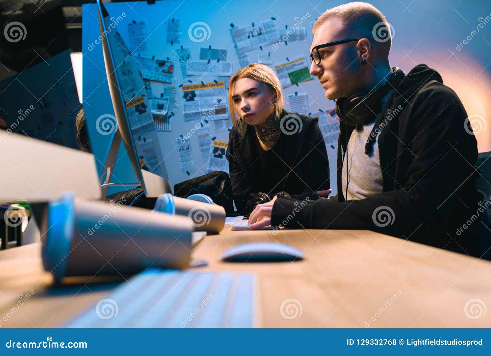 Thoughtful Couple of Hackers Working with Computer Together Stock Photo ...