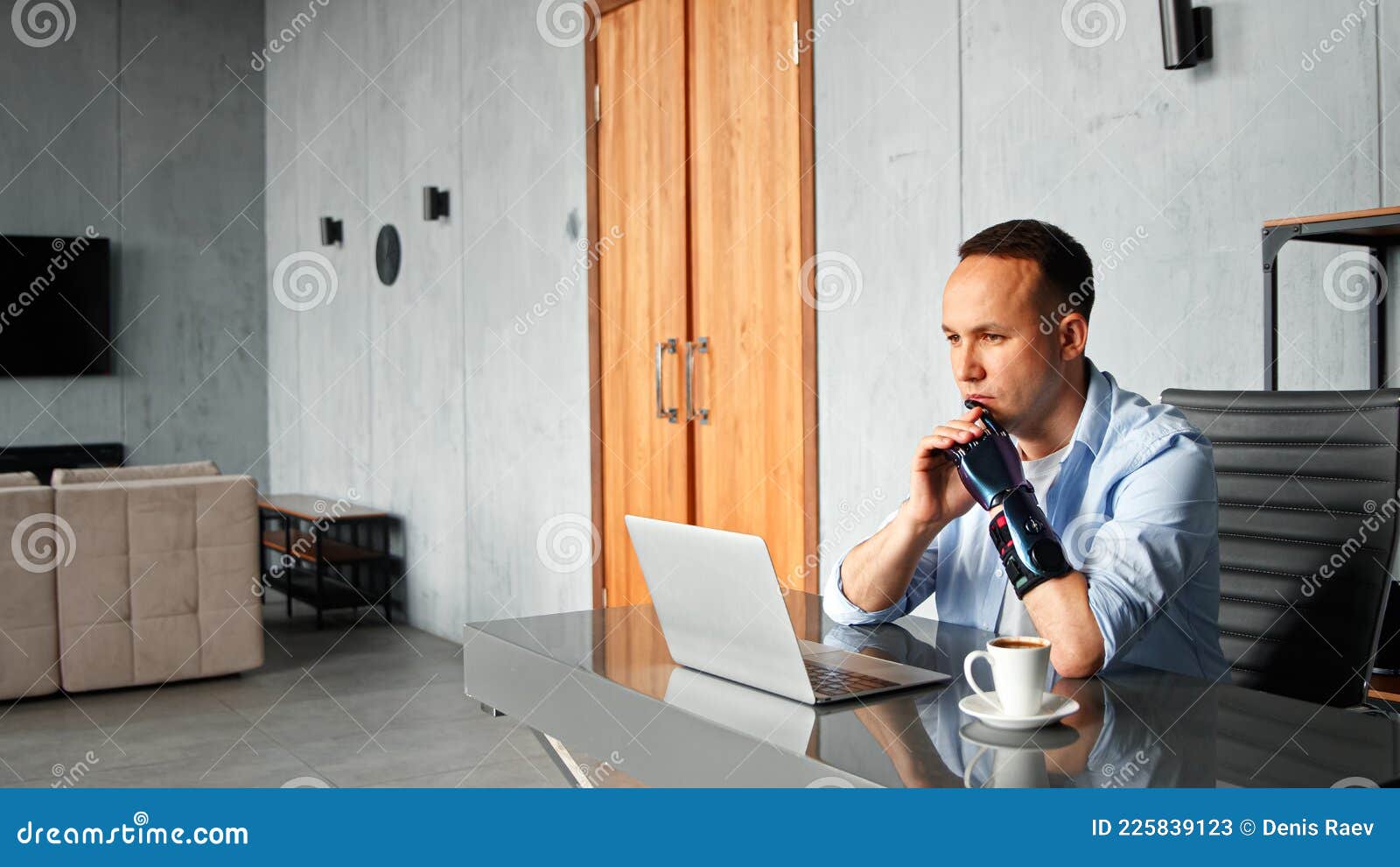 Thoughtful Cyborg Programmer with Black Bio Hand Prothesis Looks at ... Thoughtful Cyborg Programmer with Black Bio Hand Prothesis Looks at ...