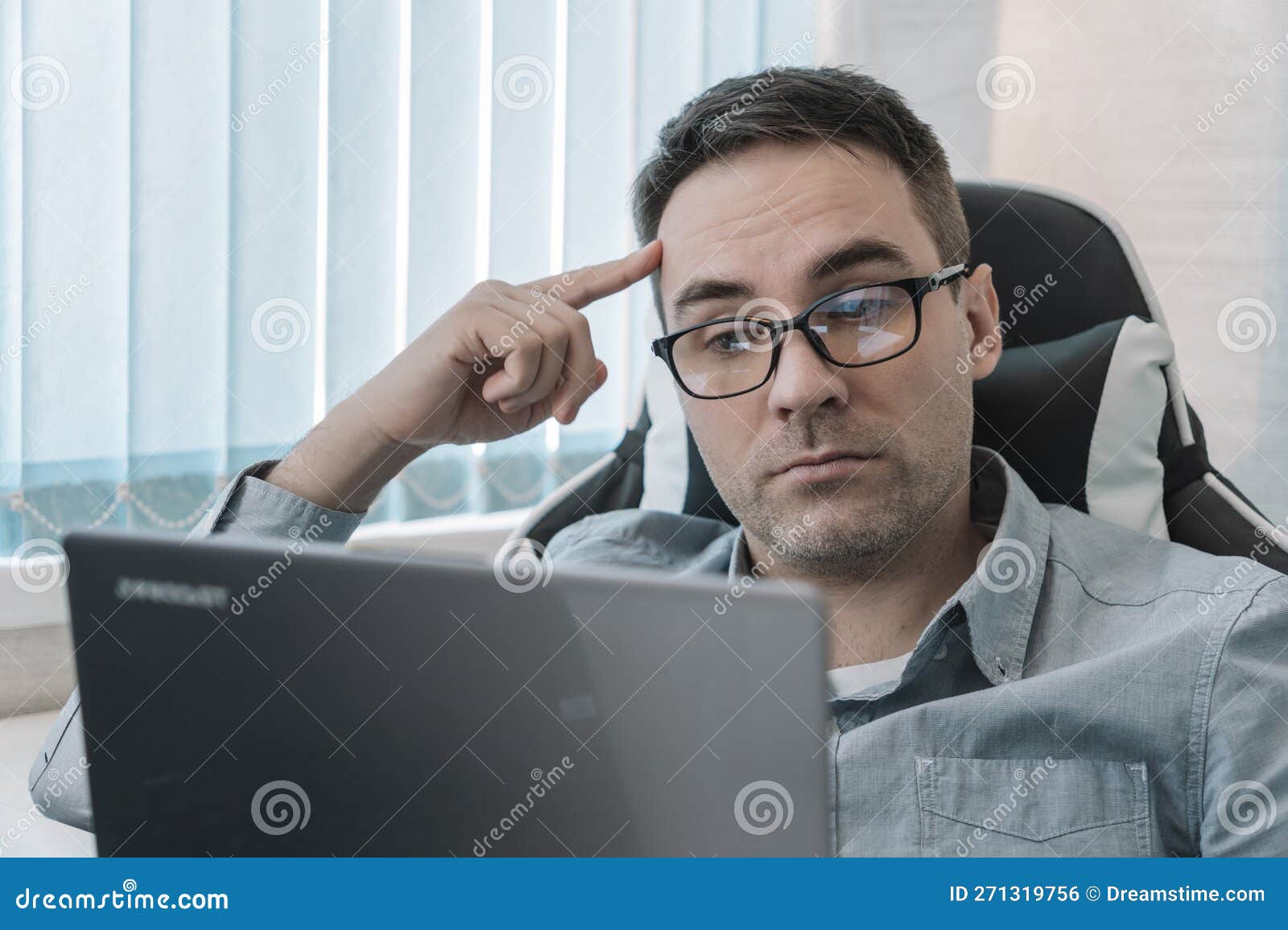 Contemplative Male Inspector Holding Clipboard Stock Photo ...