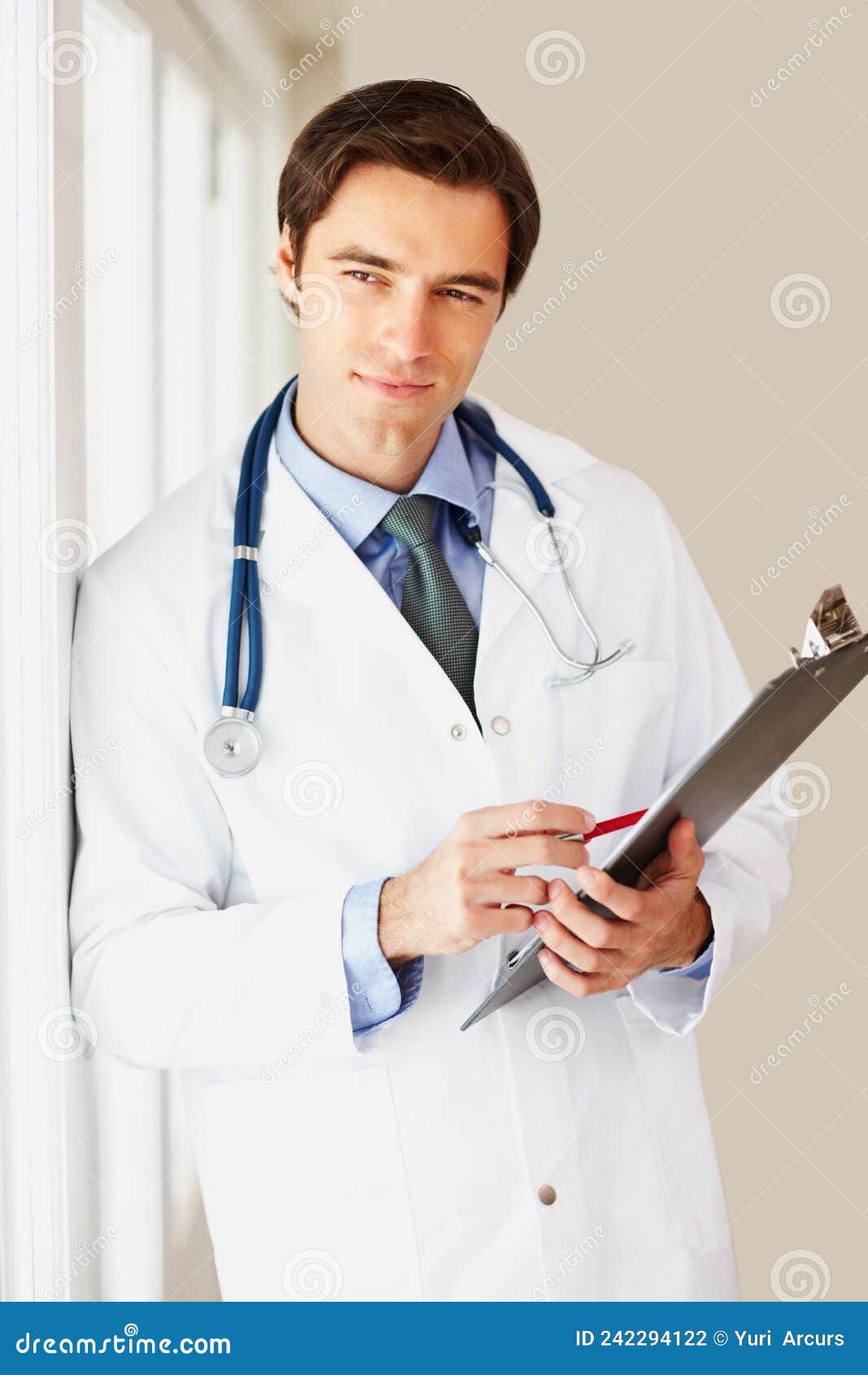 Thoughtful Doctor with Stethoscope and Notepad Looking Away. Portrait ...