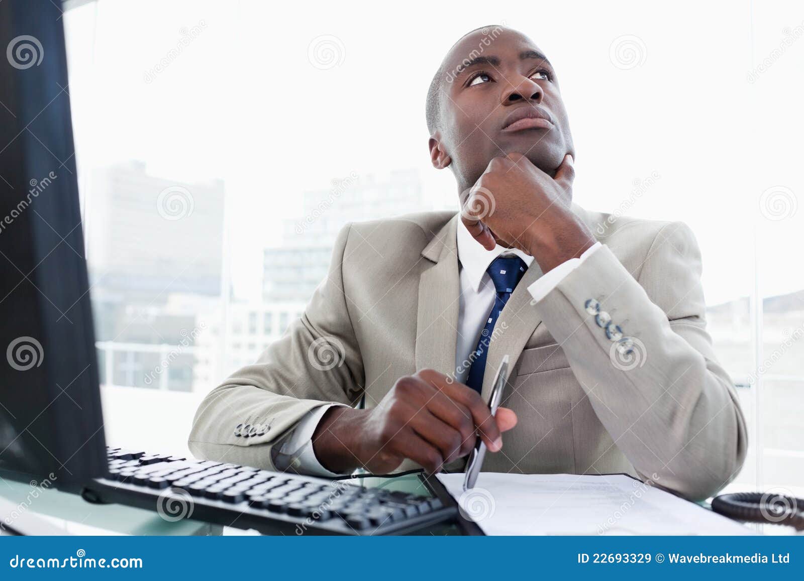 Thoughtful Entrepreneur while Working with a Computer Stock Image ...
