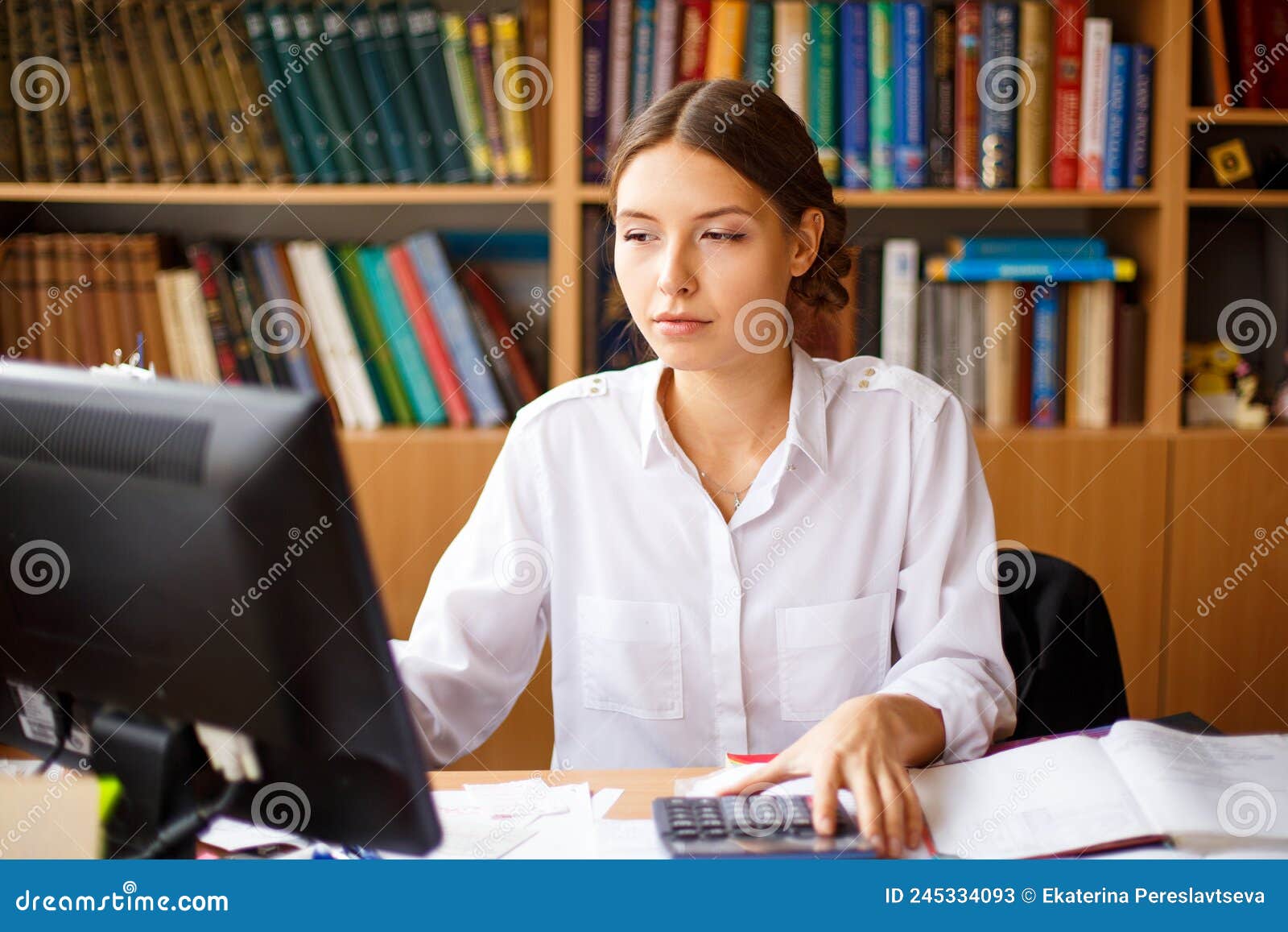 Thoughtful Female Administrative Assistant Checking Computer Reading ...
