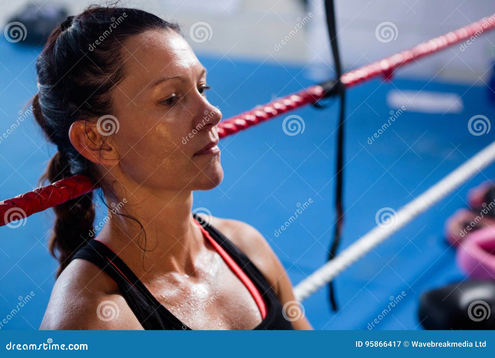 Thoughtful Female Boxer Leaning on Rope Stock Image - Image of adult ...