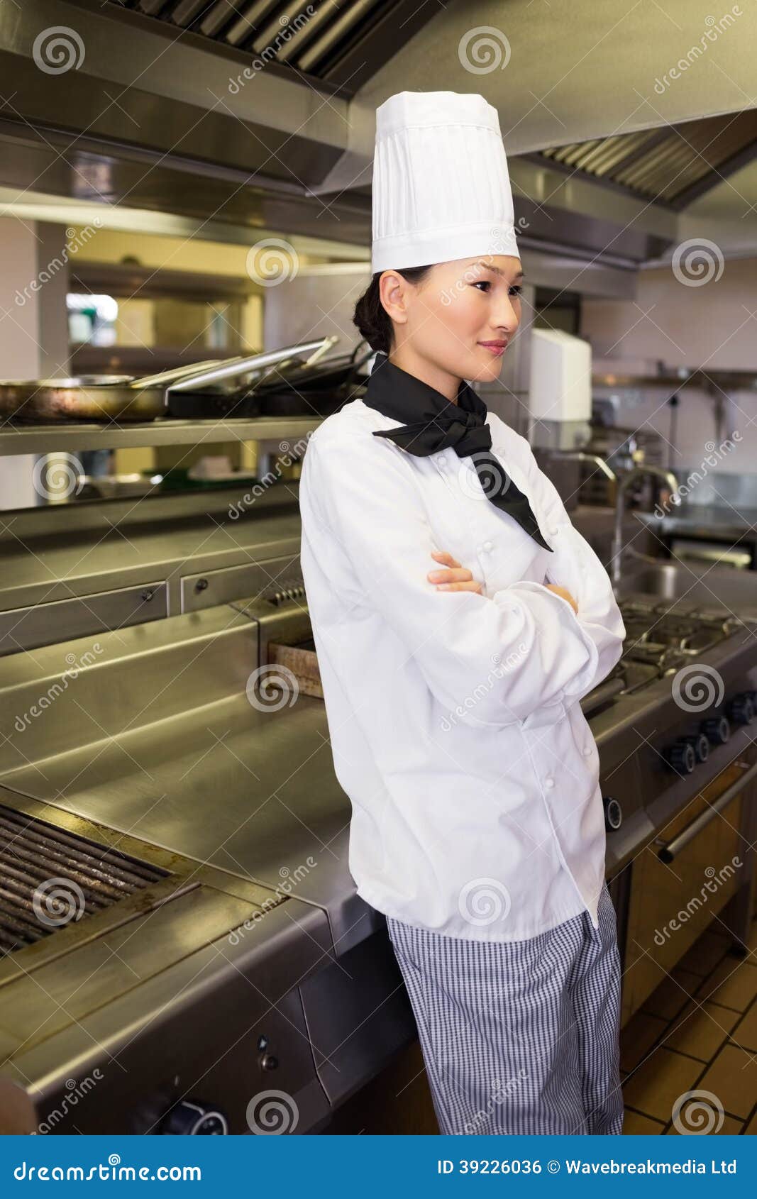 Thoughtful Female Cook Standing in Kitchen Stock Photo - Image of ...