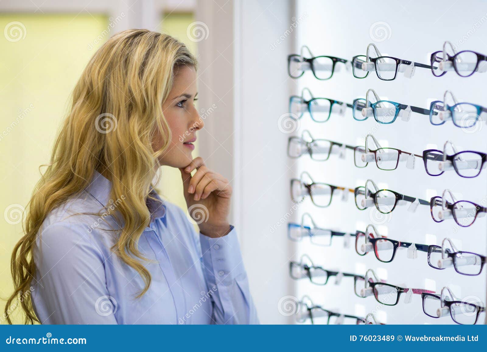 Thoughtful Female Customer Selecting Spectacles Stock Image - Image of ...