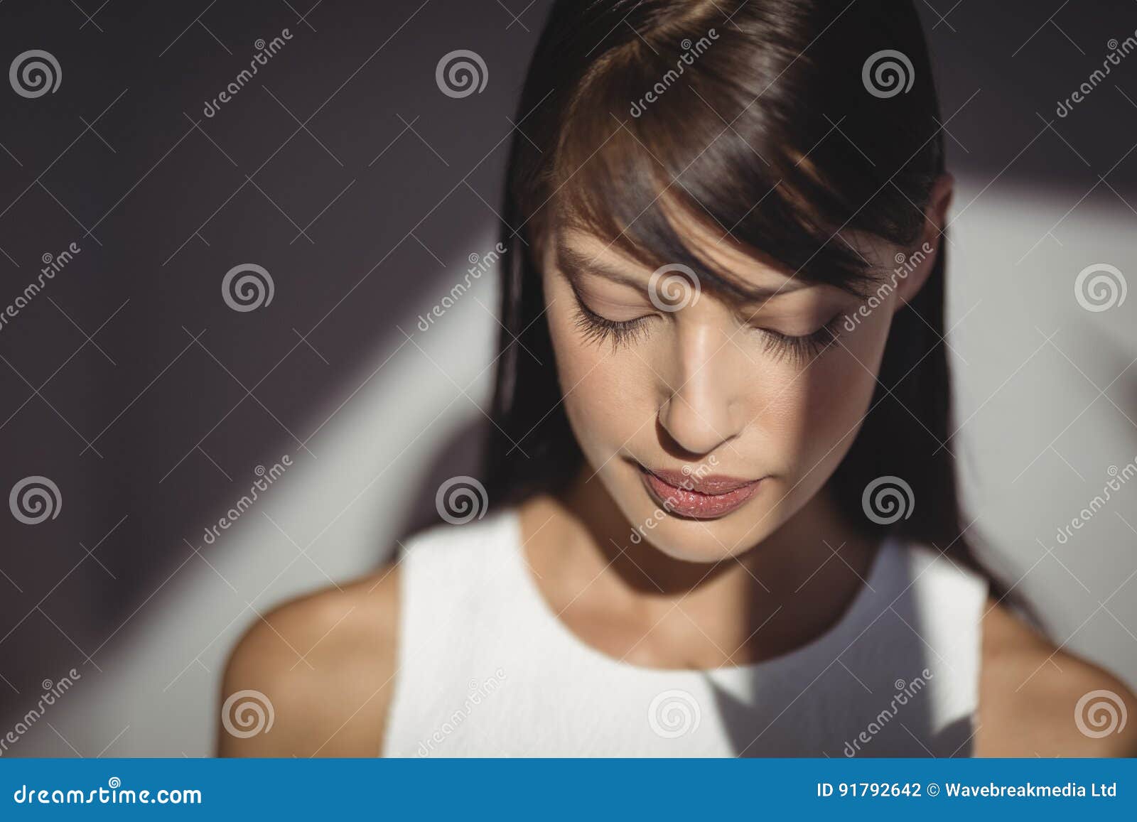 Thoughtful Female Executive Looking Down Stock Photo - Image of office ...