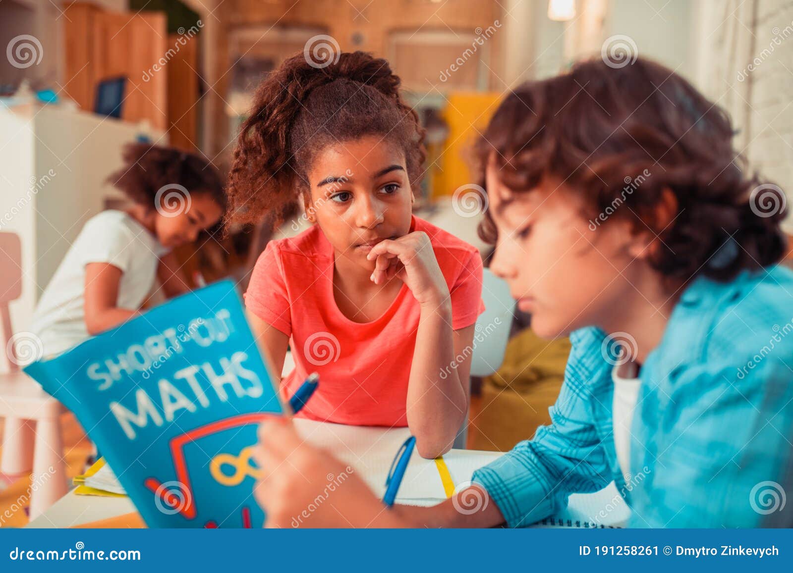 Thoughtful Girl Learning Math with Her Classmate Stock Image - Image of ...