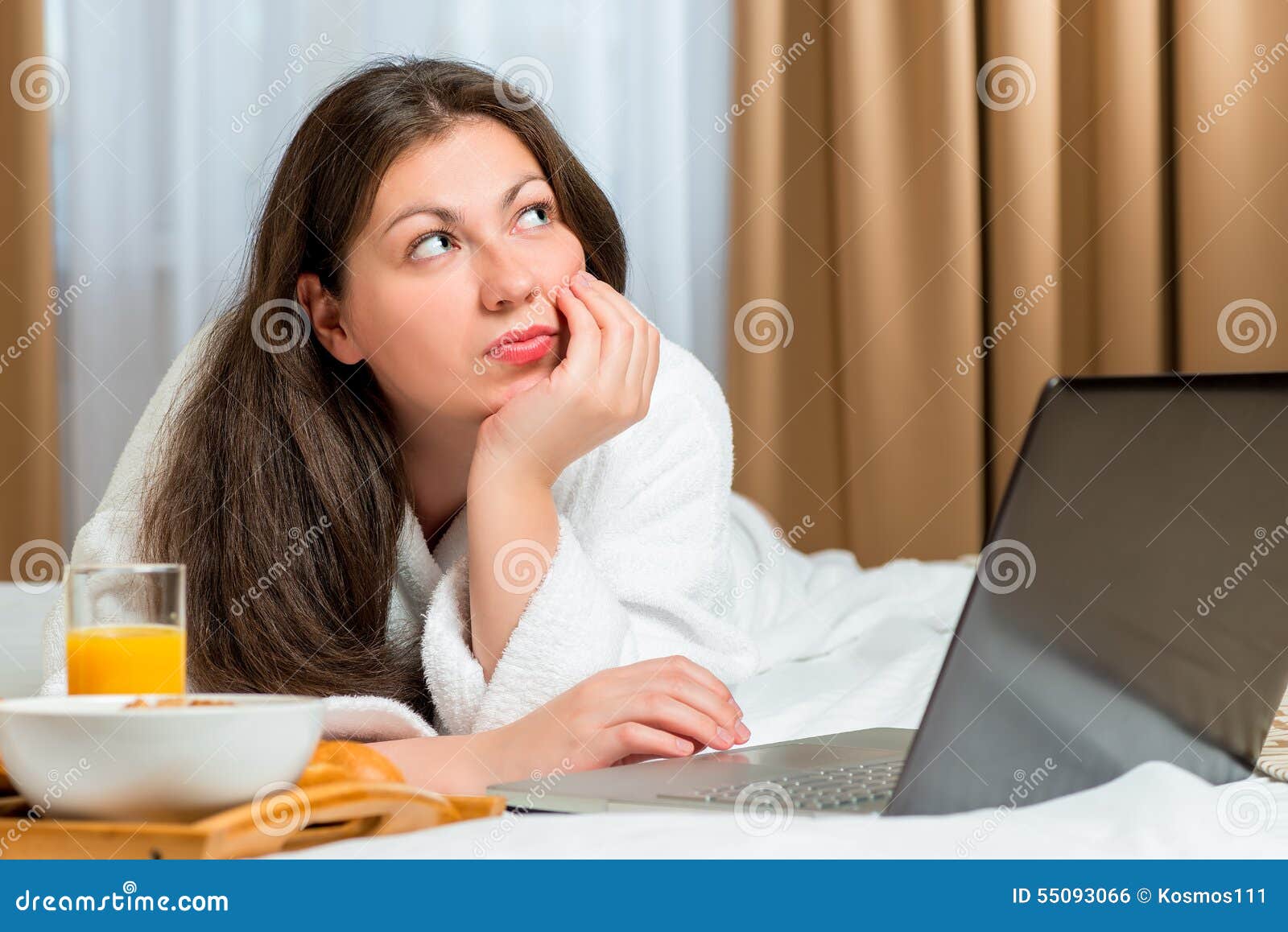 Thoughtful Girl Working Lying Down on Bed Stock Photo - Image of ...