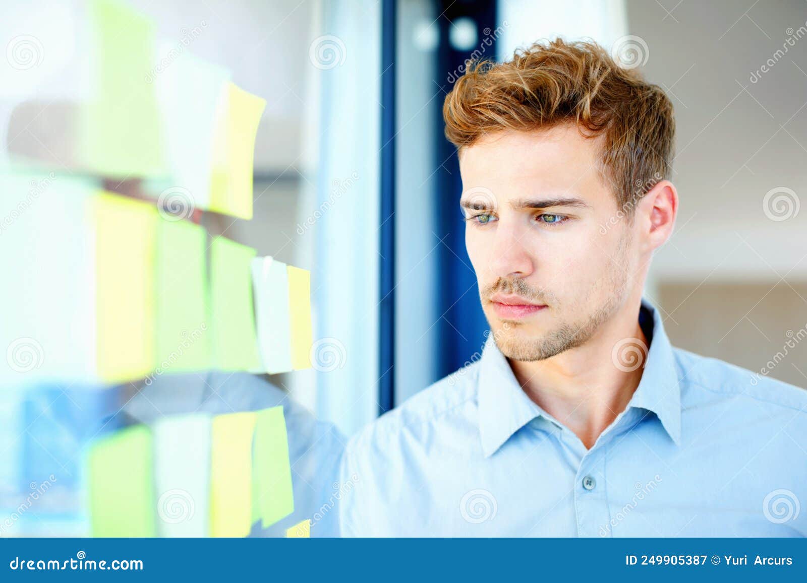 Thoughtful Guy Looking at Adhesive Notes. Thoughtful Business Man ...