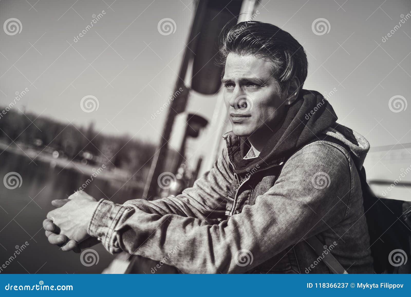 Thoughtful Guy Standing on the Bridge Looking on the River Stock Image ...